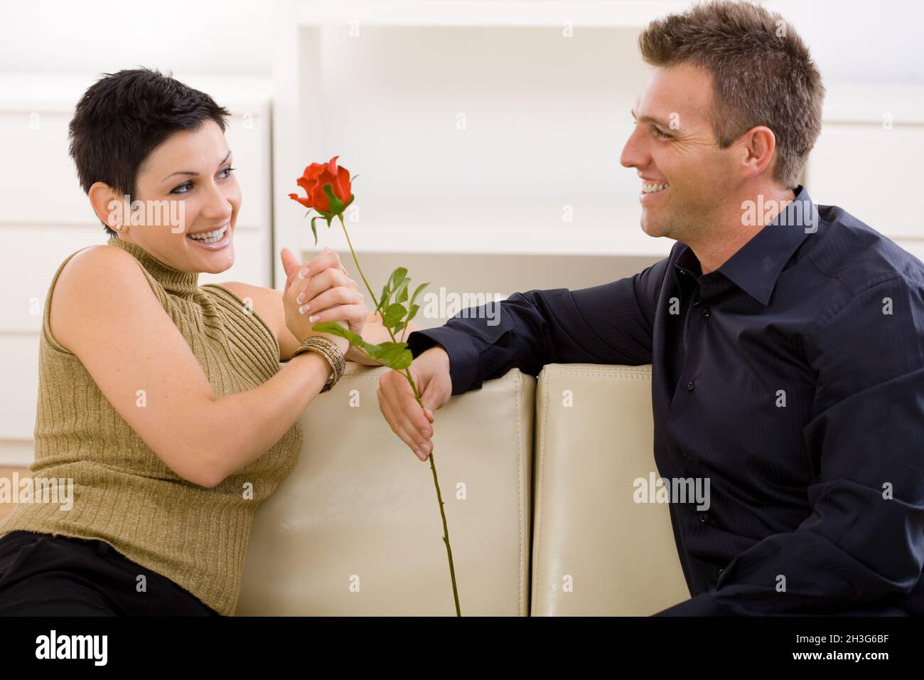Man giving red rose Stock Photo - Alamy