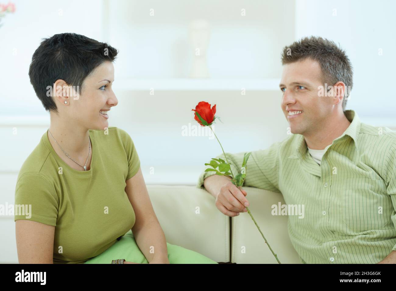 Man giving red rose Stock Photo - Alamy