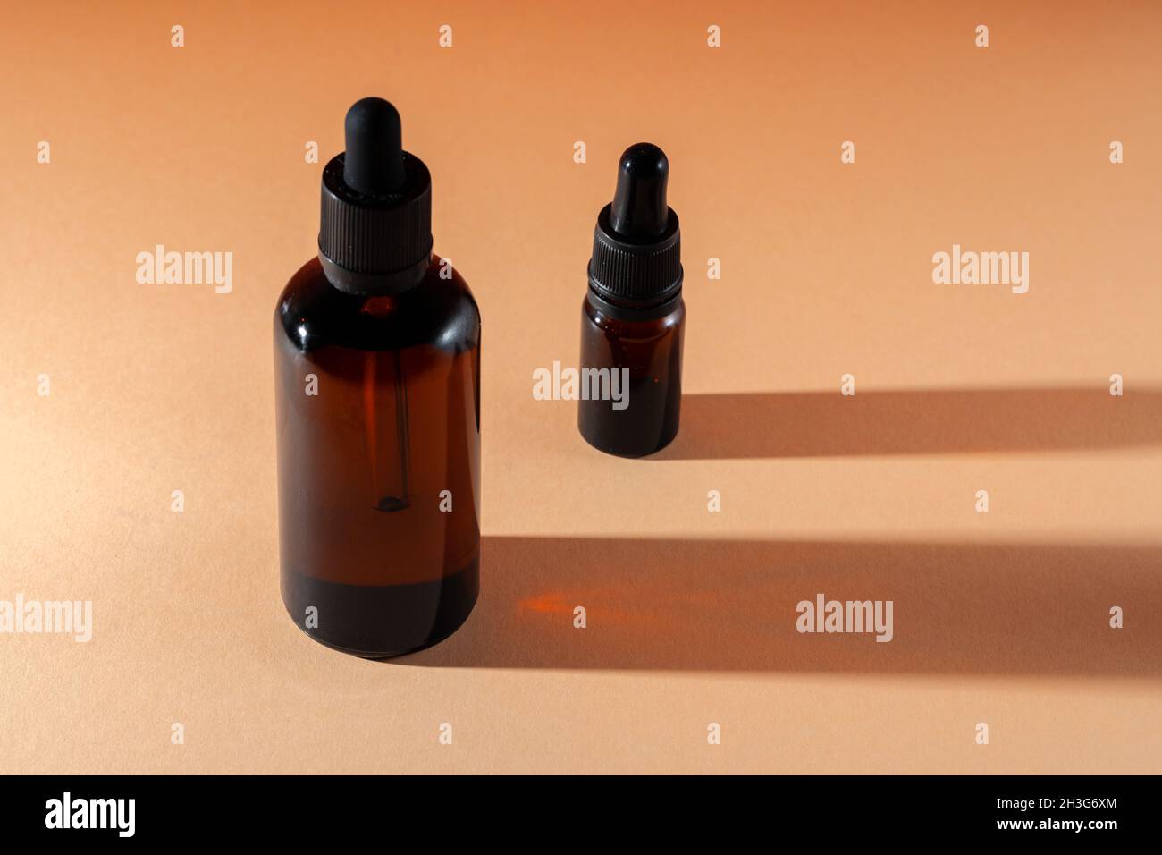 Cosmetic aromatic spa oil in brown glass bottle Stock Photo - Alamy