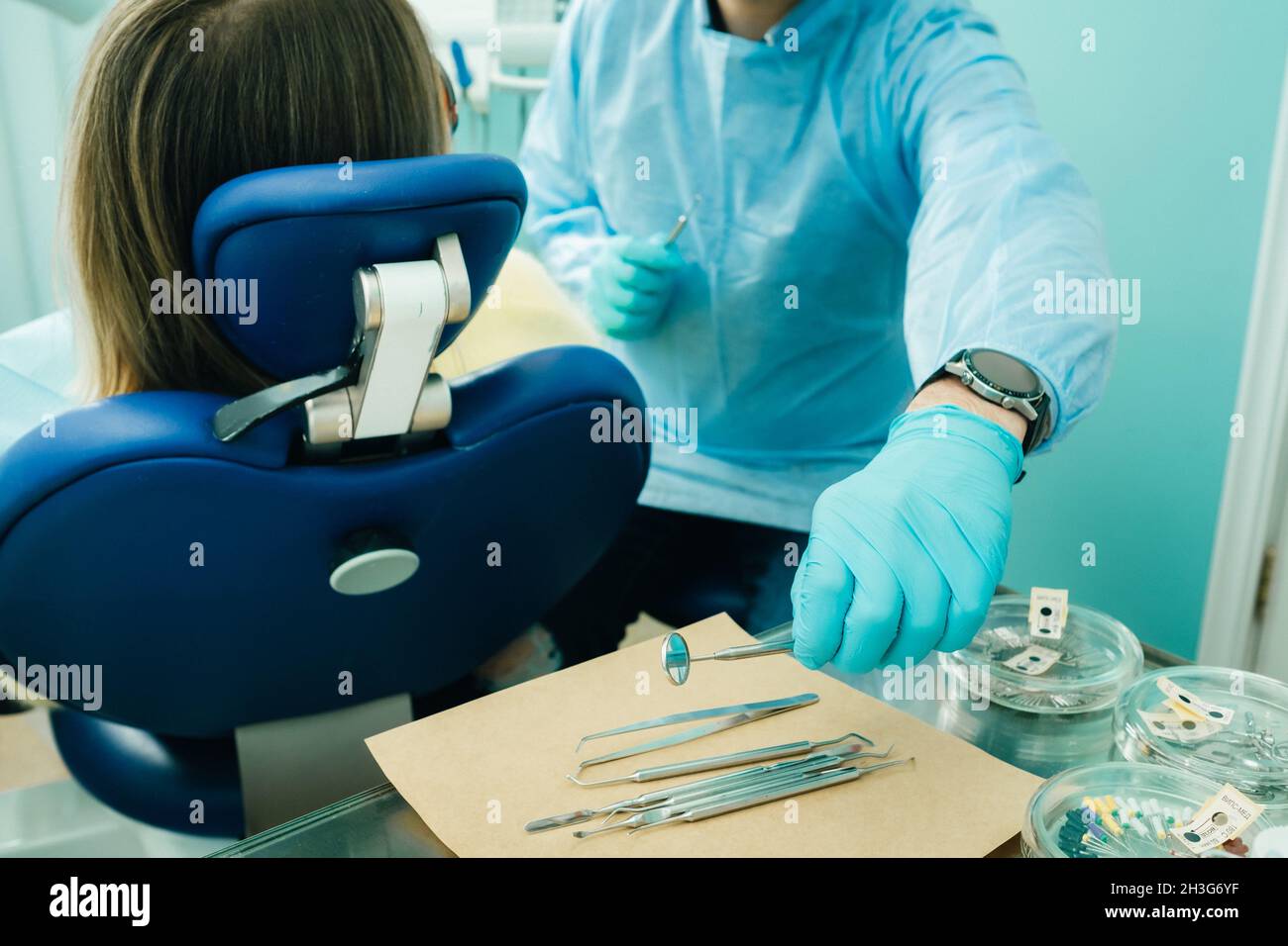 Dentist wearing surgical glove hi-res stock photography and images - Alamy
