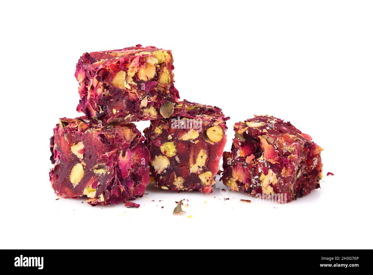 Traditional turkish delight rahat lokum with nuts and rose petals on a ...