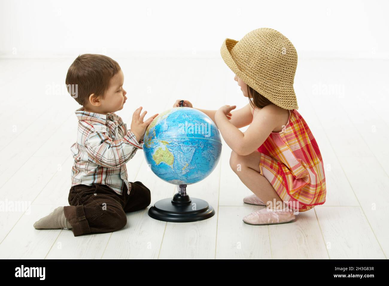 Children playing with globe Stock Photo - Alamy