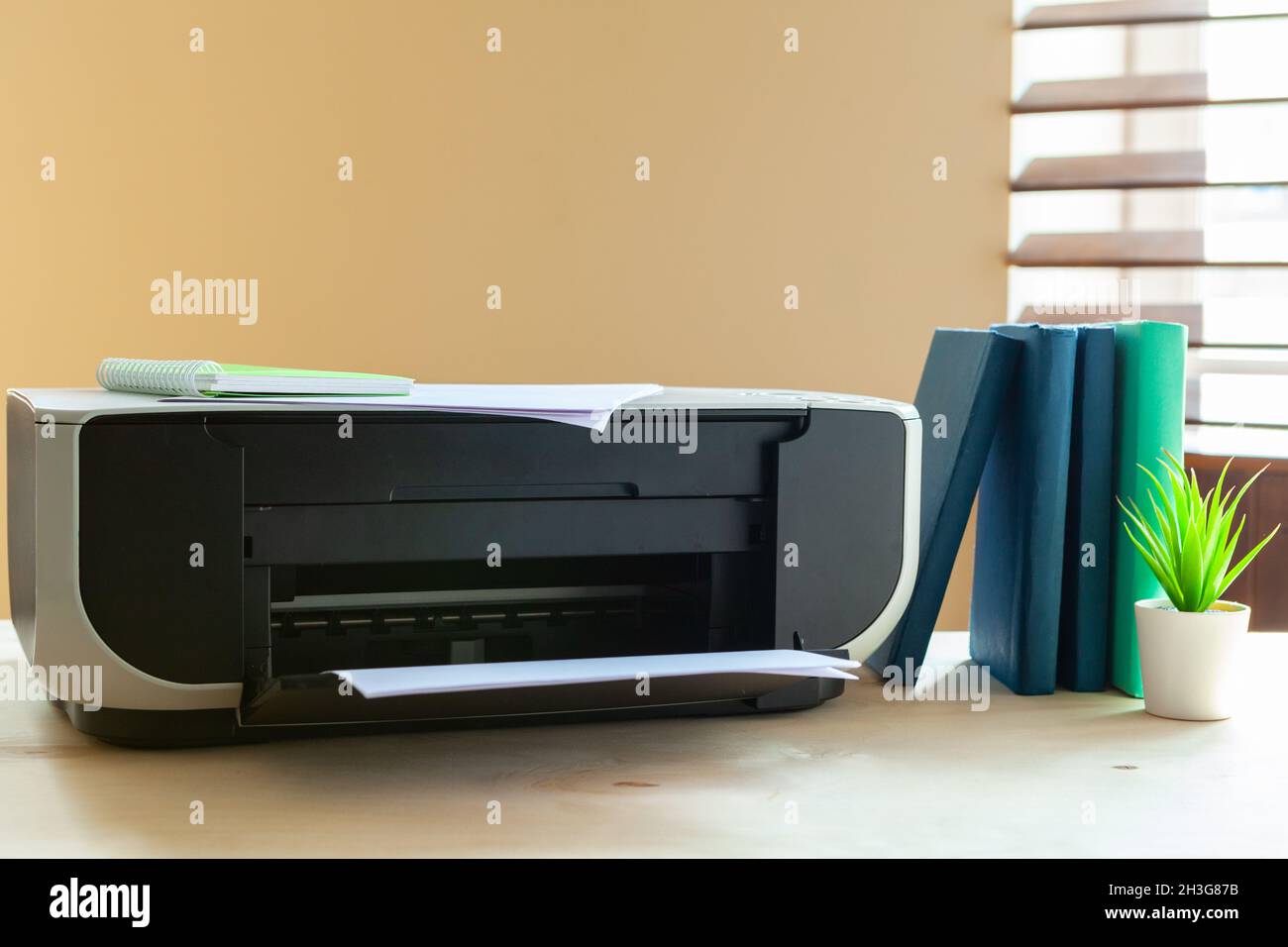 Close up of an office table with printer on it Stock Photo - Alamy