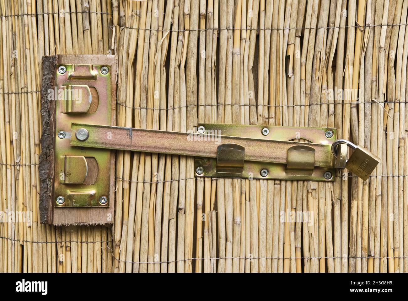 Straw mat door with lock Stock Photo - Alamy
