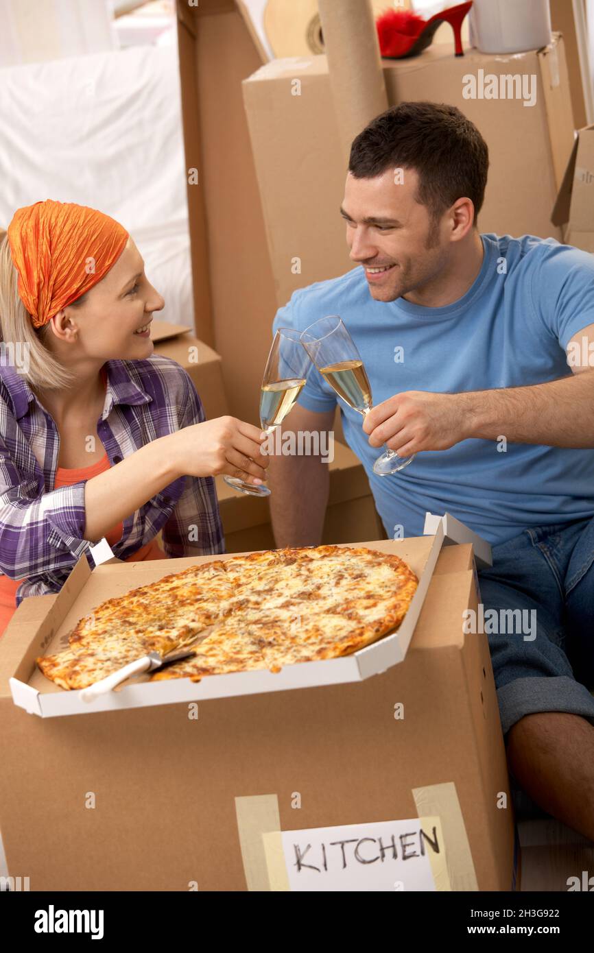 Pizza break at moving house Stock Photo - Alamy