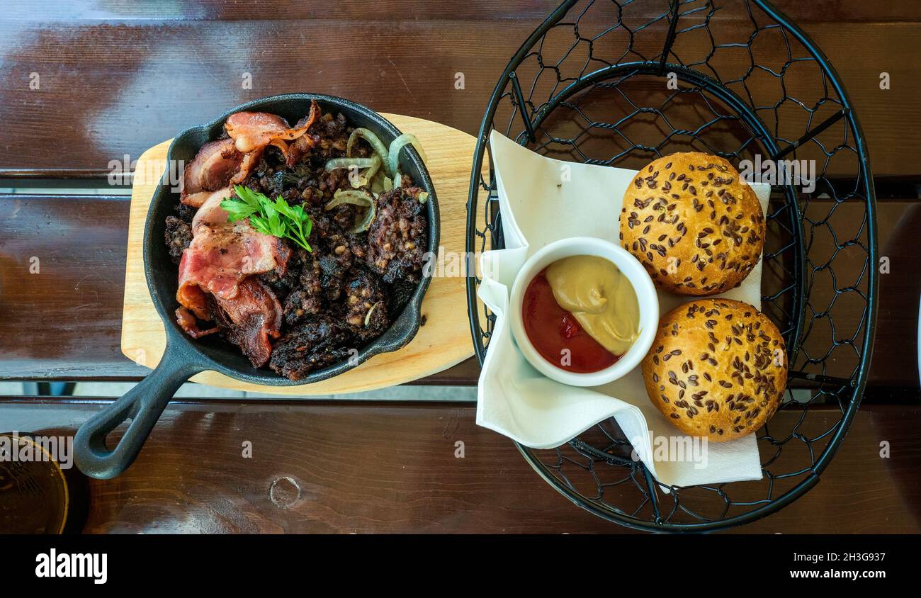 Bread loaf with sauce next to Kaszanka, Polish delicacy made from pork ...