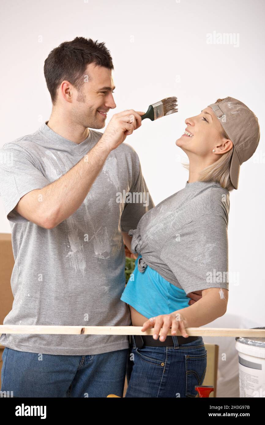 Couple having fun at painting Stock Photo - Alamy