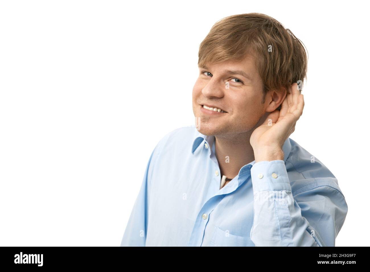 Portrait of listening young man Stock Photo - Alamy