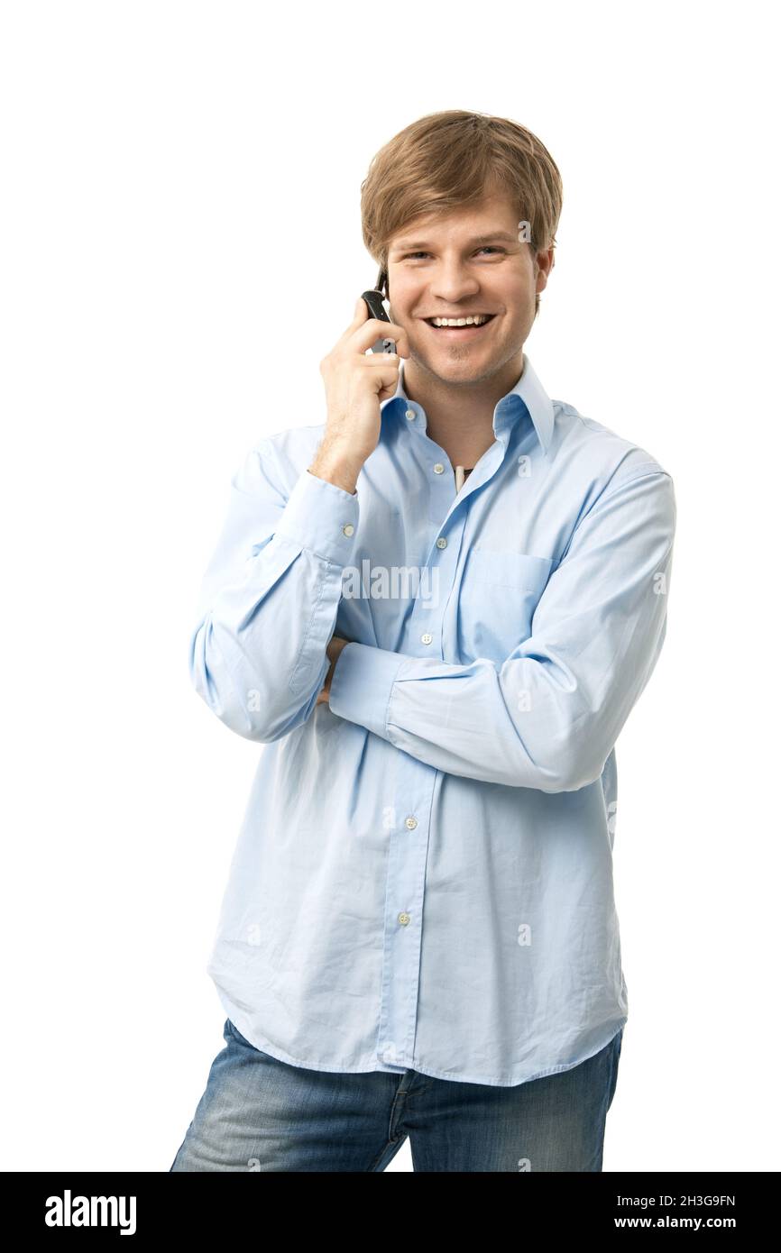 Casual young man talking on mobile Stock Photo - Alamy