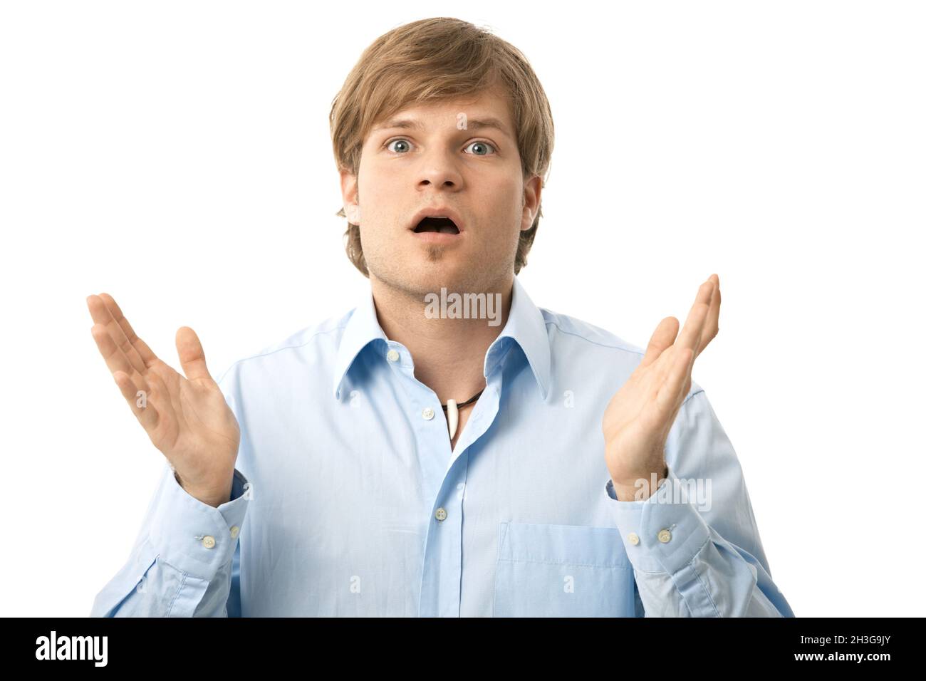 Surprised young man Stock Photo - Alamy