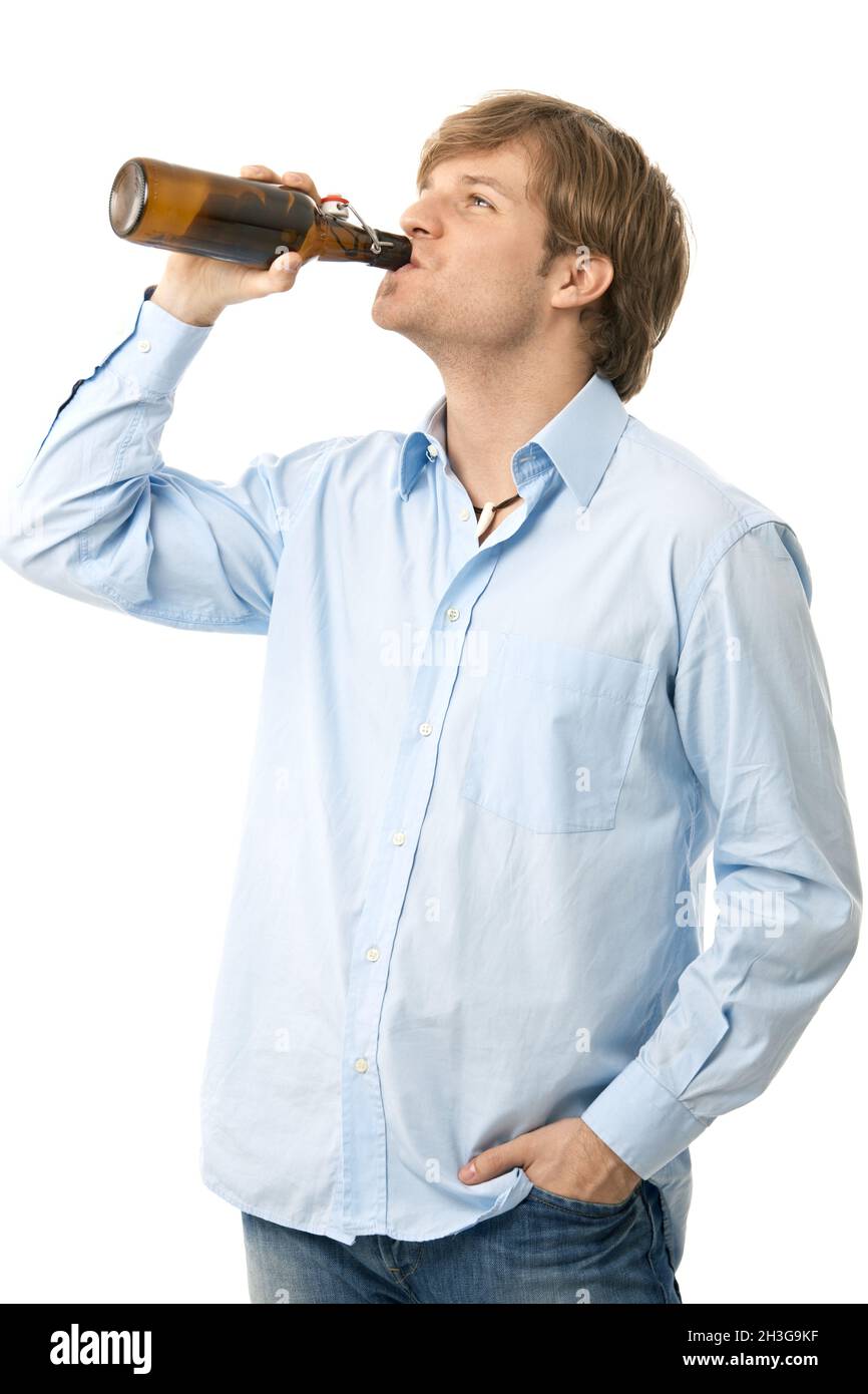 Casual young drinking beer Stock Photo - Alamy