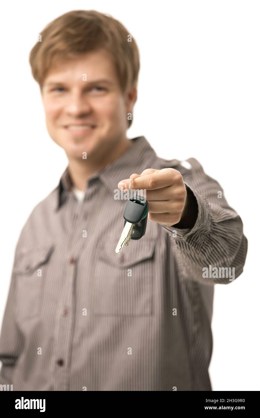 Young man handing over ignition keys Stock Photo - Alamy
