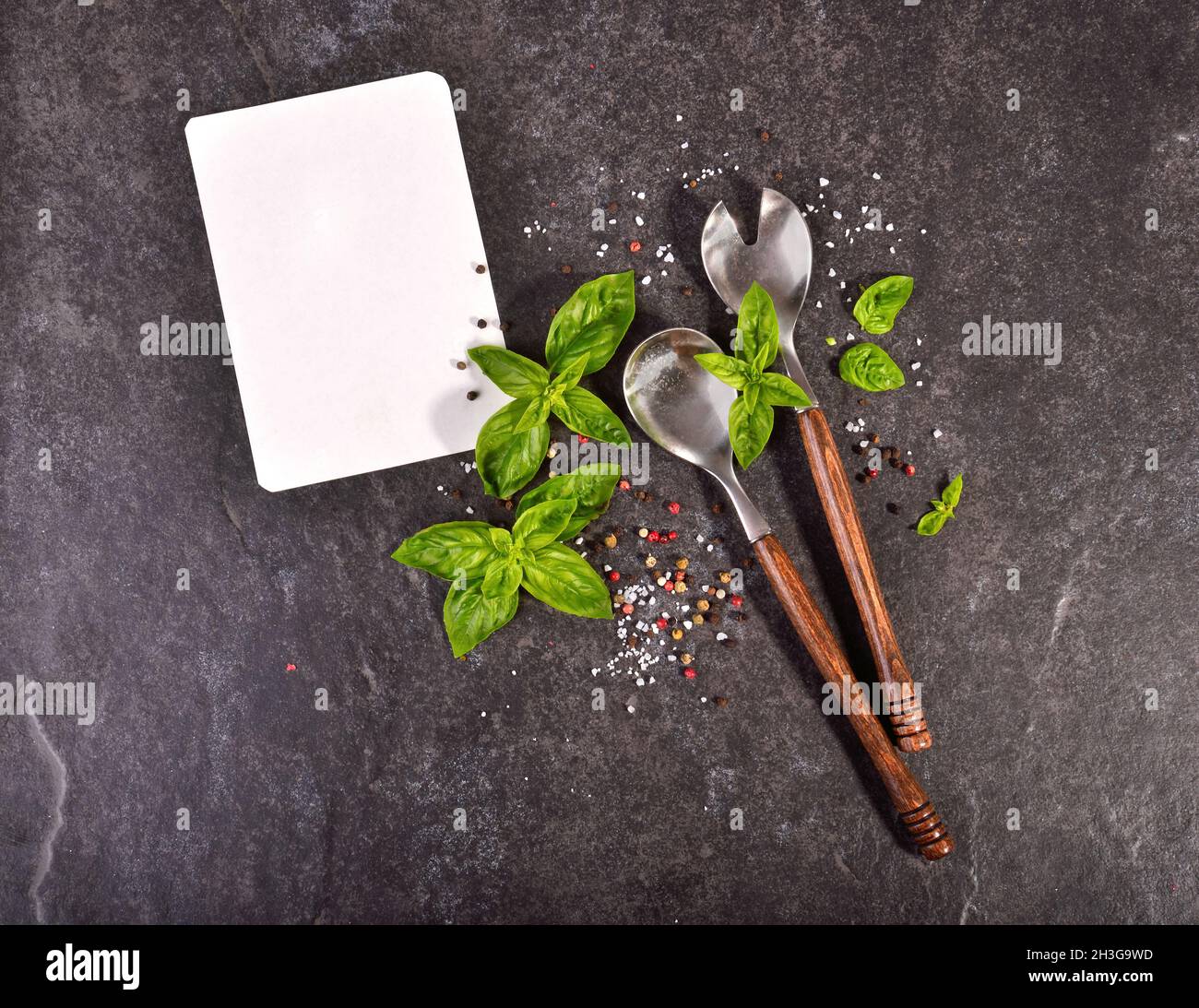 Top view of Blank paper menu laying on the stone desk with salt, pepper ...