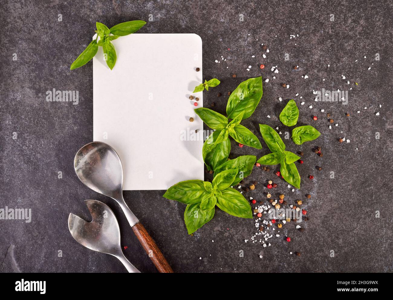 Top view of blank paper menu laying on the stone desk with salt, pepper ...