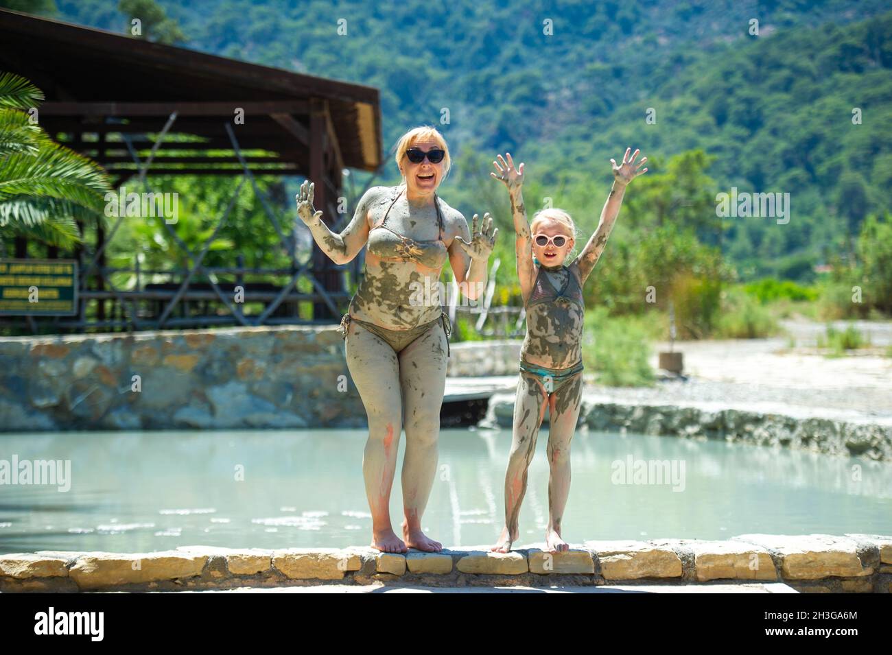 A happy family takes a mud bath at a resort in Turkey.Family wellness in therapeutic mud Stock ...