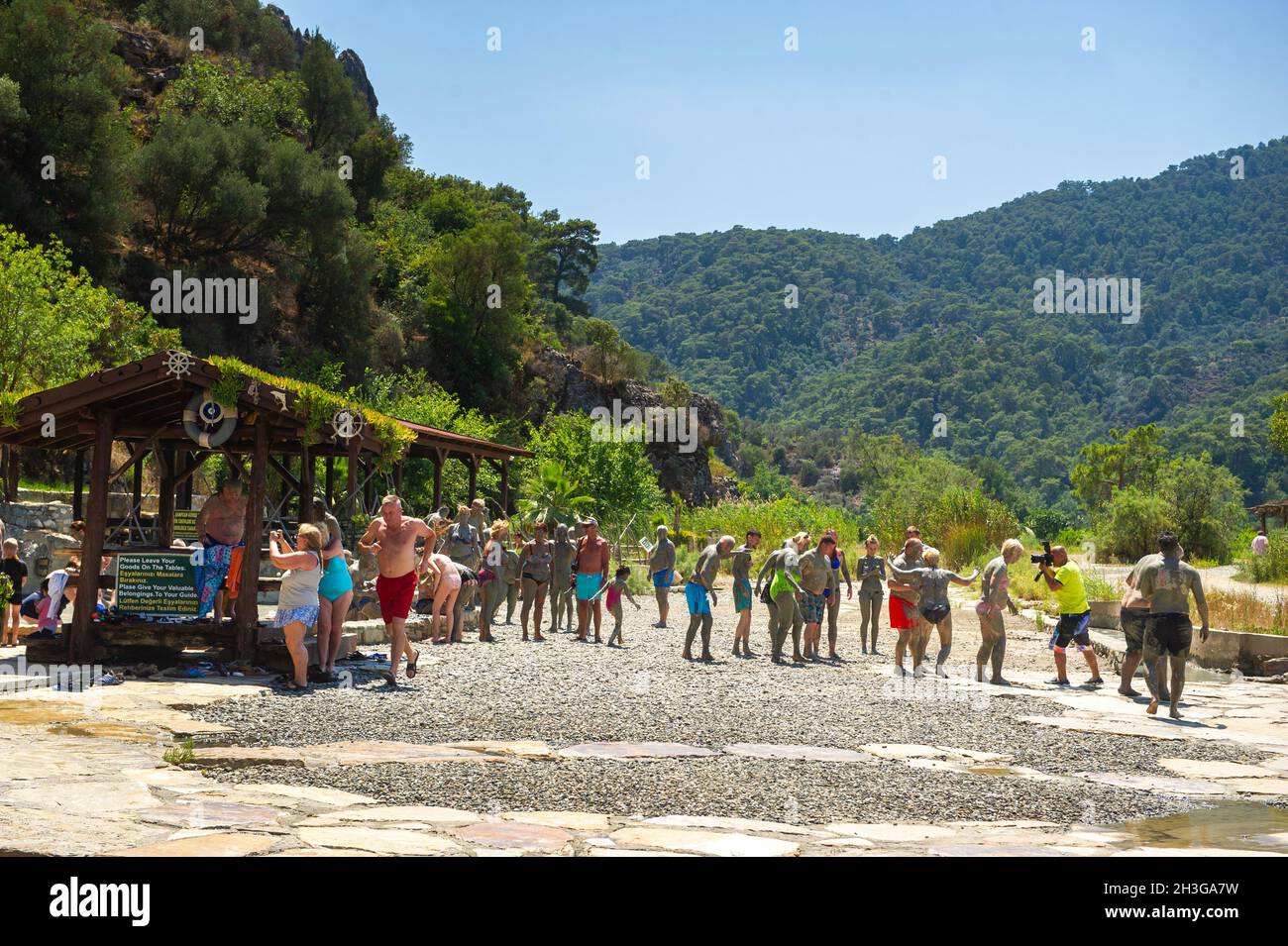 DALYAN, TURKEY-JUNE 21, 2018: Tourists enjoy mud baths near the town of ...