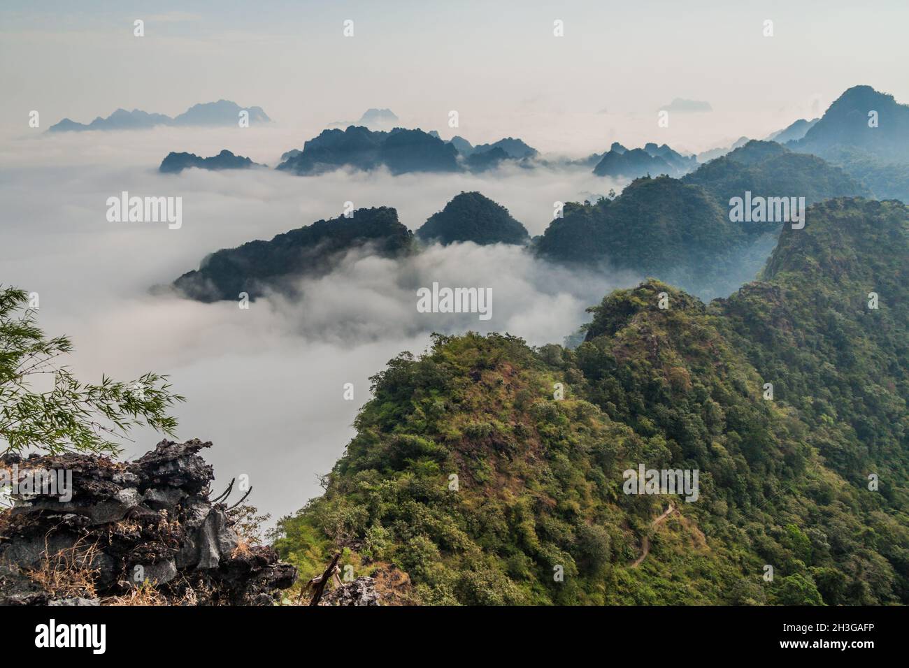 Mountains around Mt Zwegabin in a mist near Hpa An, Myanmar Stock Photo ...