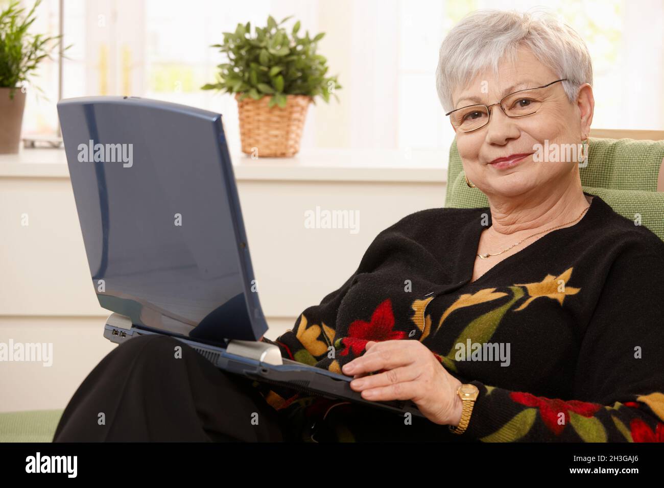 Portrait of elderly lady with computer Stock Photo - Alamy