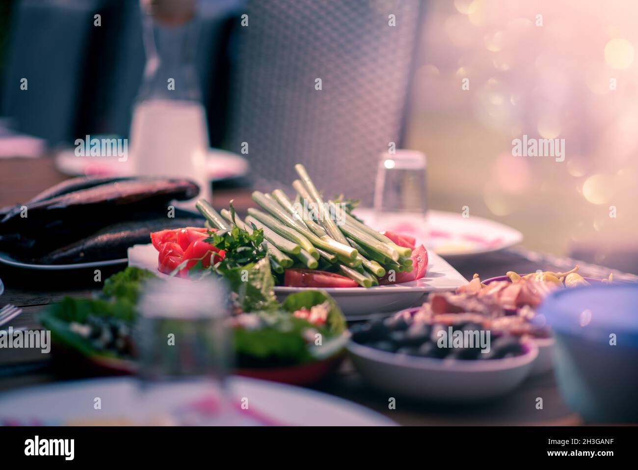 Outdoor table with served plate Stock Photo - Alamy