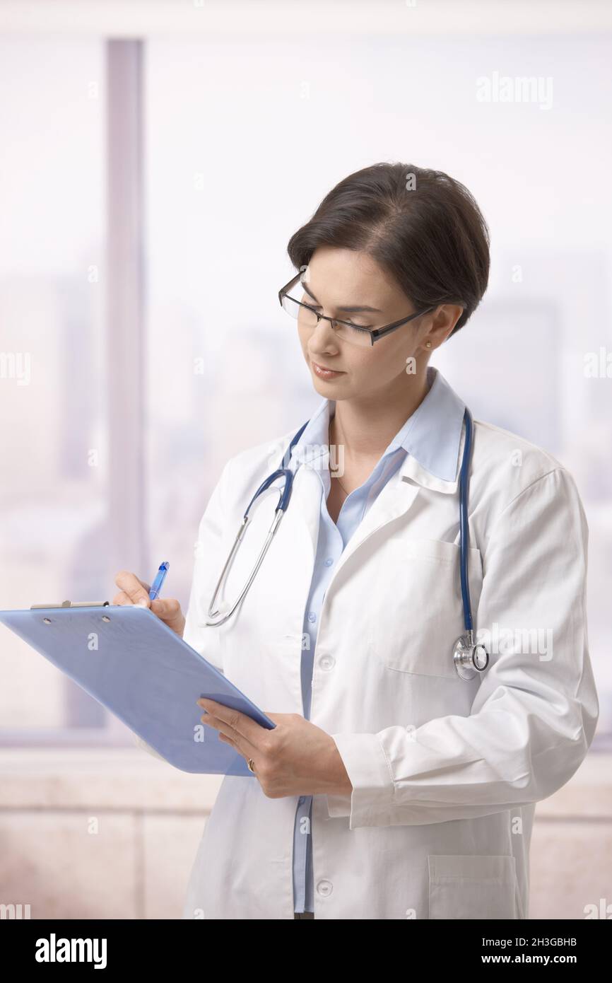 Pretty woman doctor doing hi-res stock photography and images - Alamy