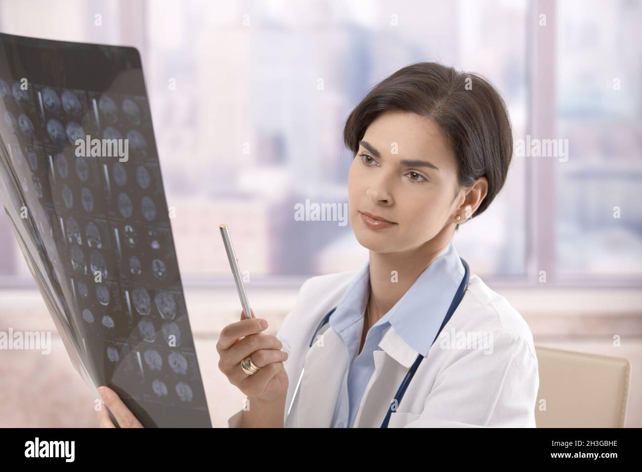 Attractive doctor examining ray hi-res stock photography and images - Alamy