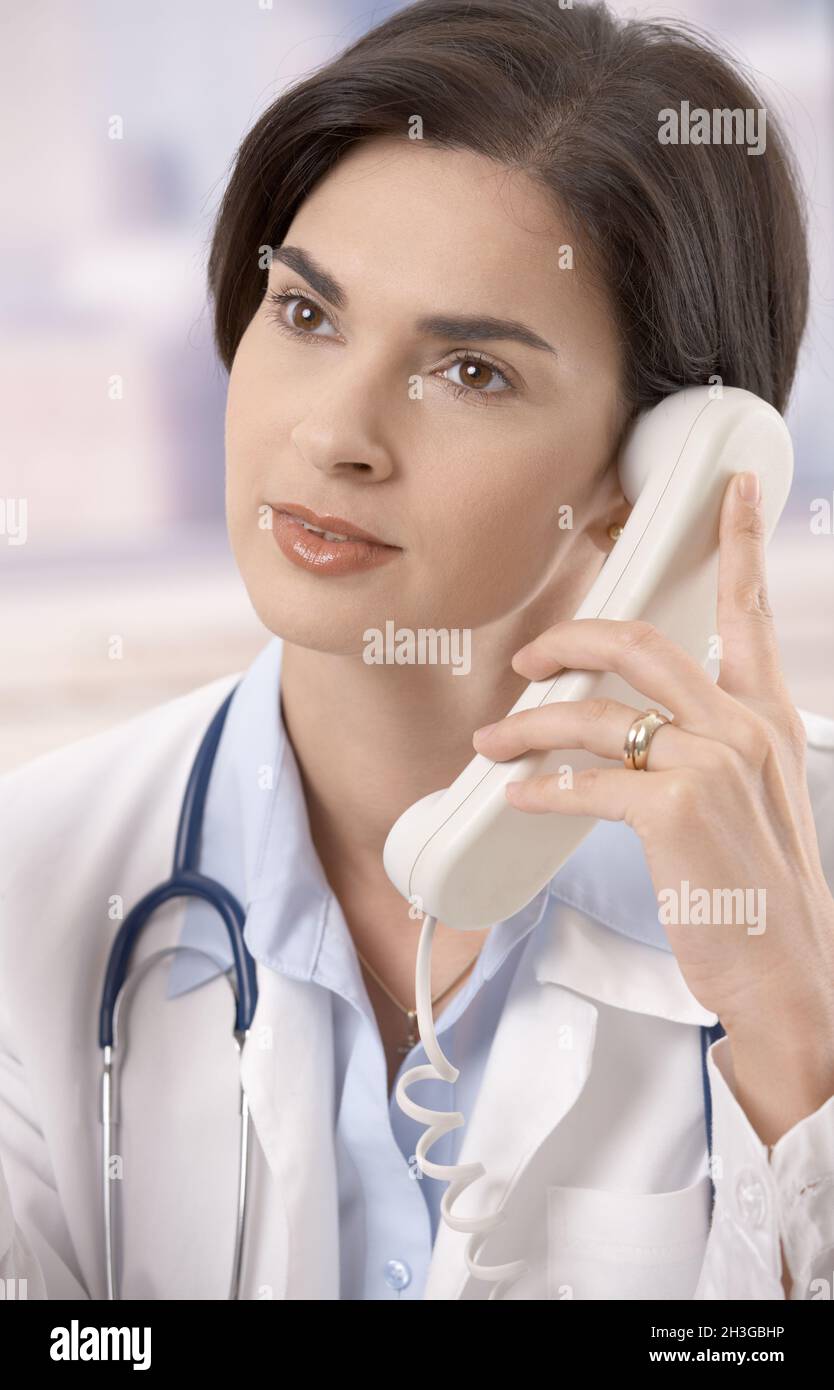 Clinician on phone hi-res stock photography and images - Alamy