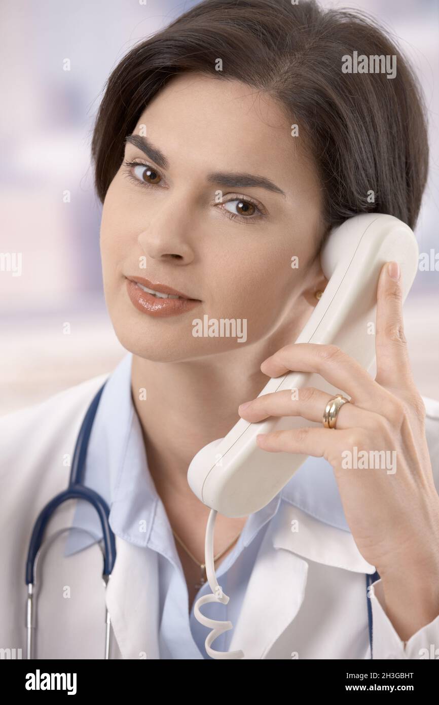 Doctor talking on phone closeup hi-res stock photography and images - Alamy