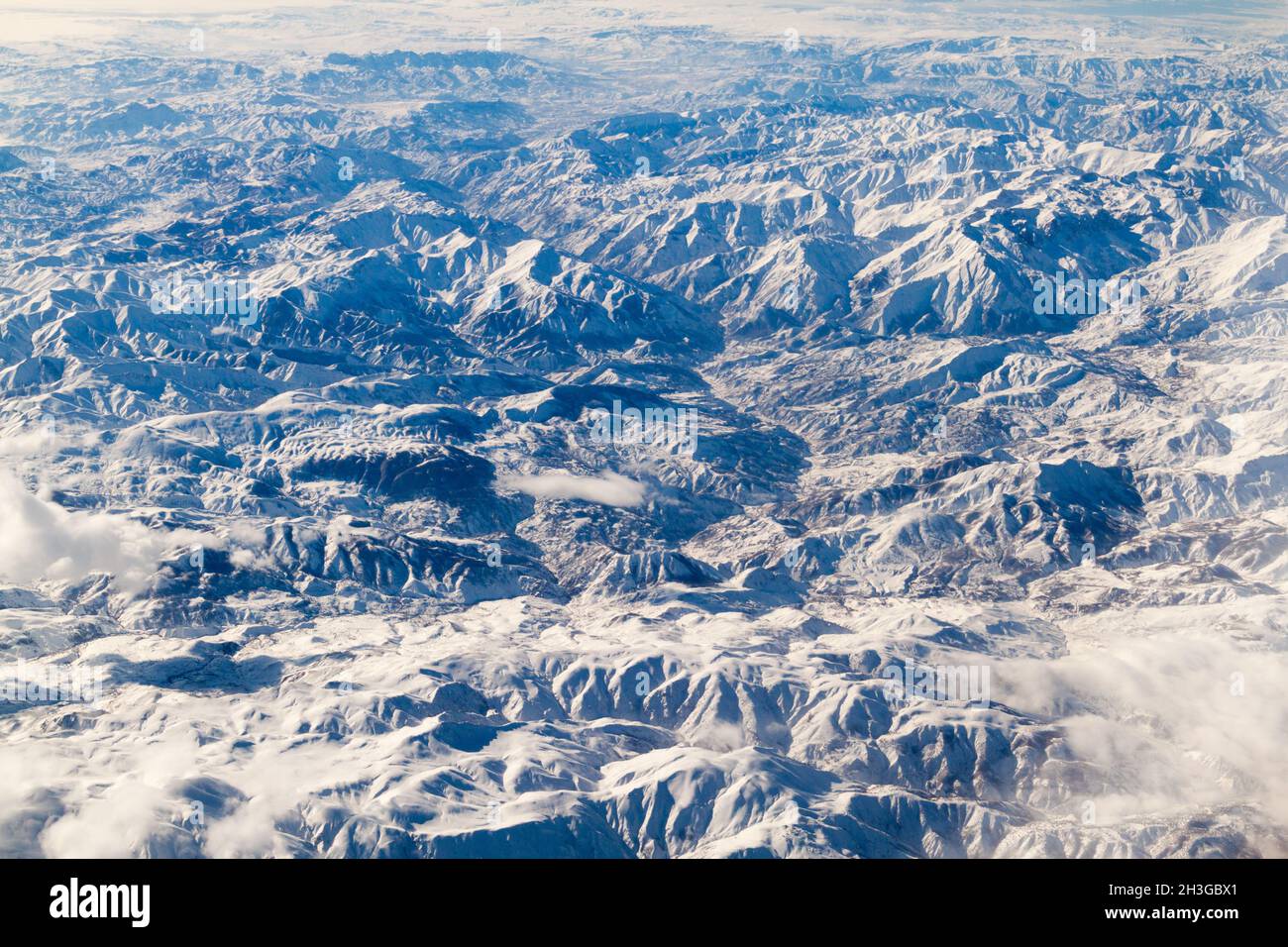 Aerial view of snow covered mountains in northeastern Iran Stock Photo ...