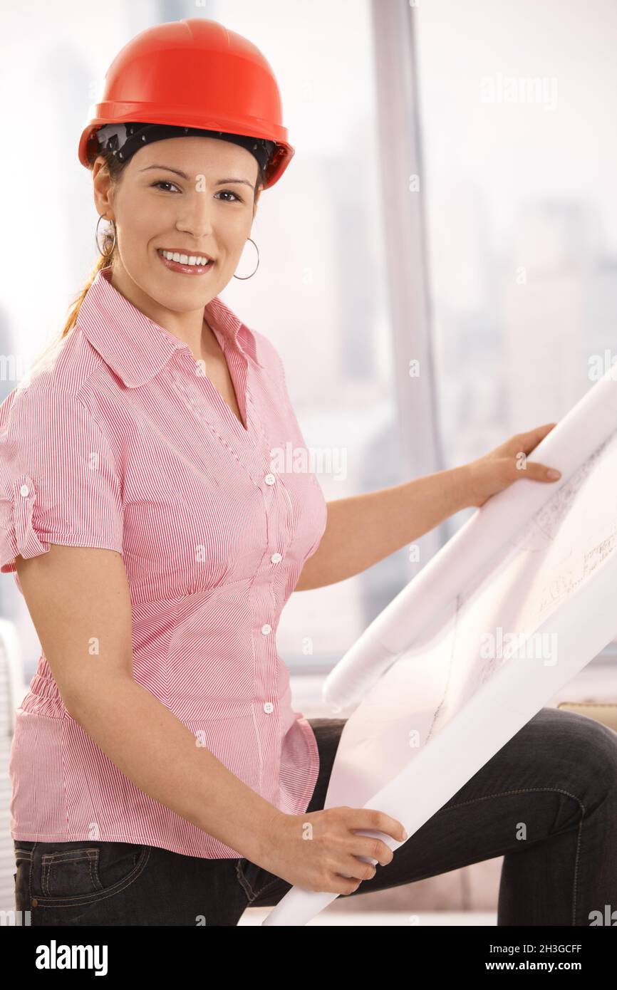 Architect looking at floor plan Stock Photo - Alamy
