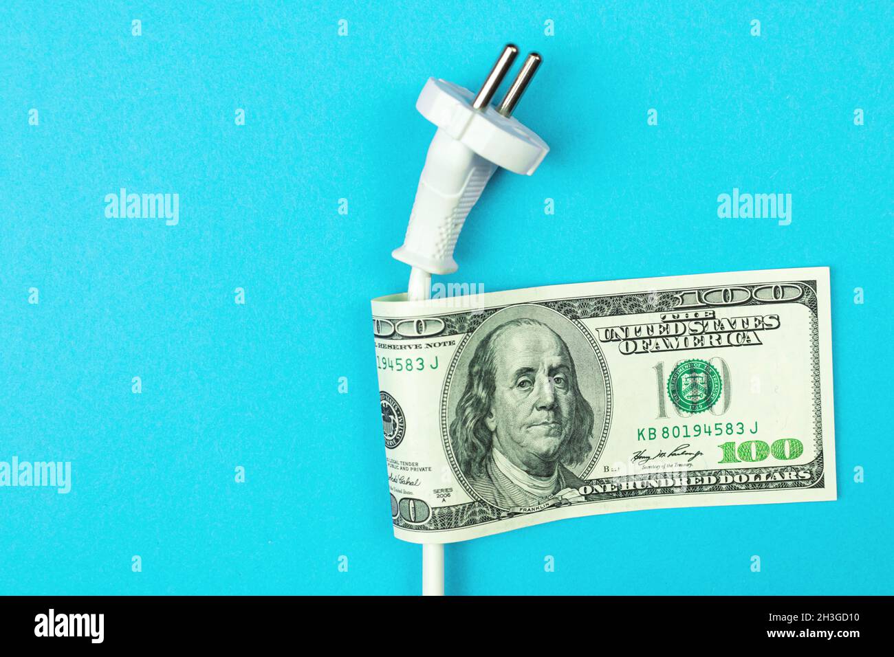 Electricity costs. Electrical power cable with EU plug and money ...