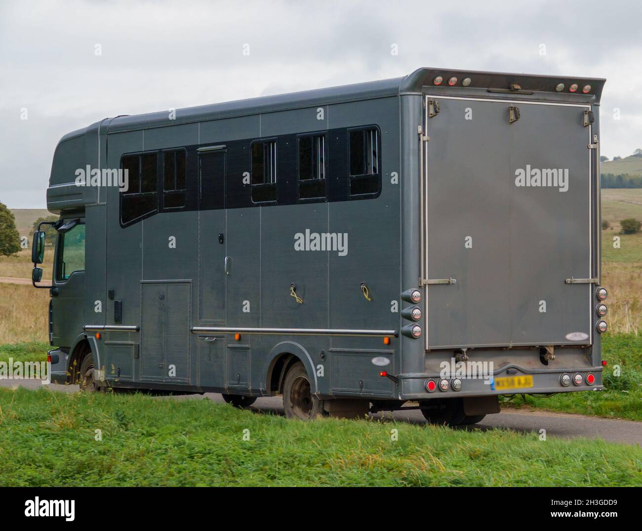 large grey coach work horse transport lorry in motion Stock Photo - Alamy