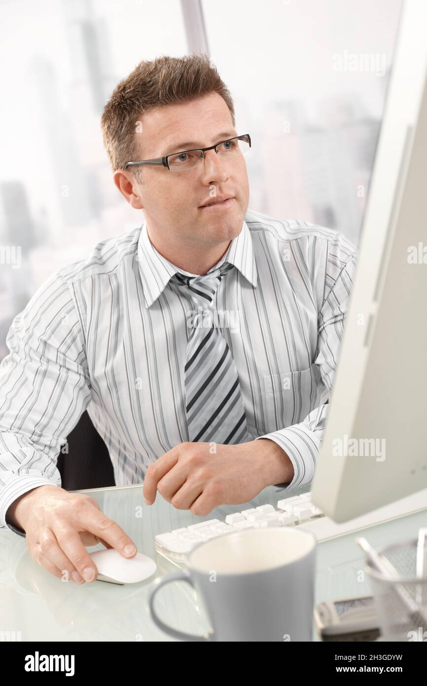 Businessman using computer Stock Photo - Alamy