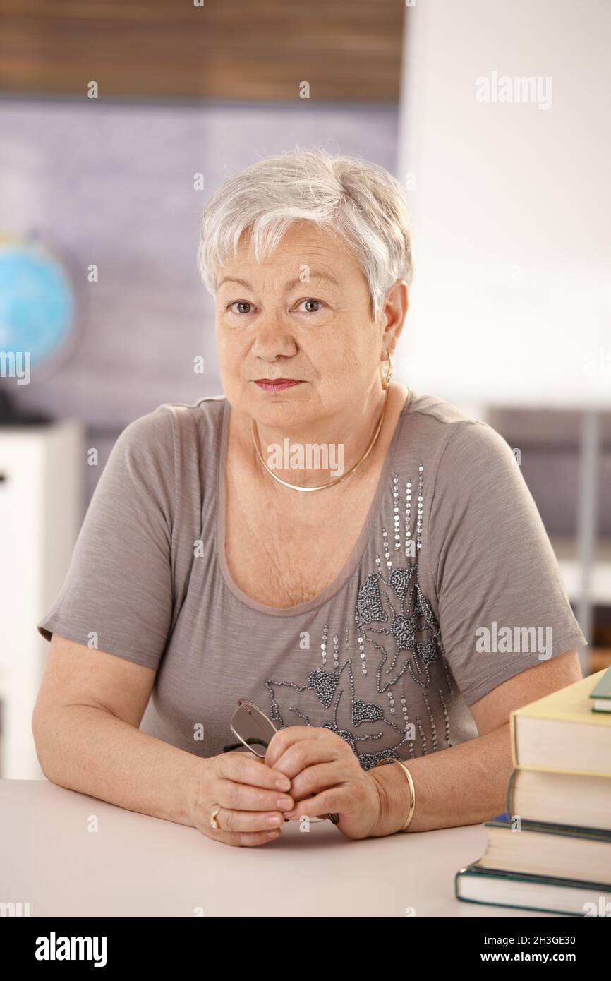 Portrait of senior teacher in school Stock Photo - Alamy