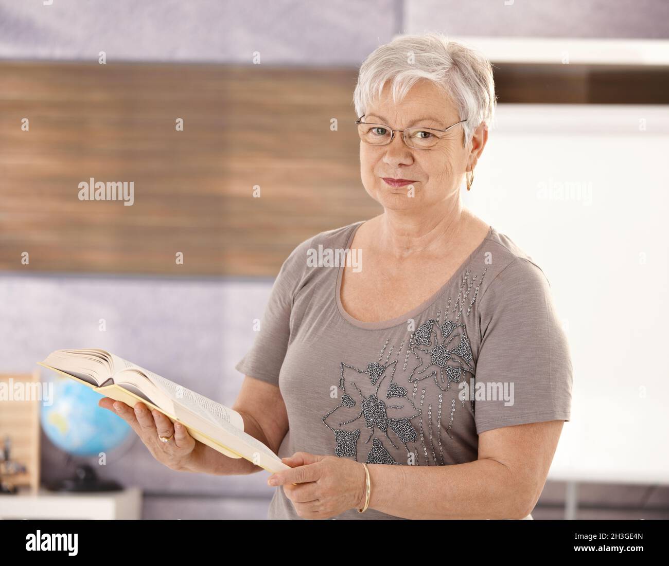 Senior teacher in school Stock Photo - Alamy