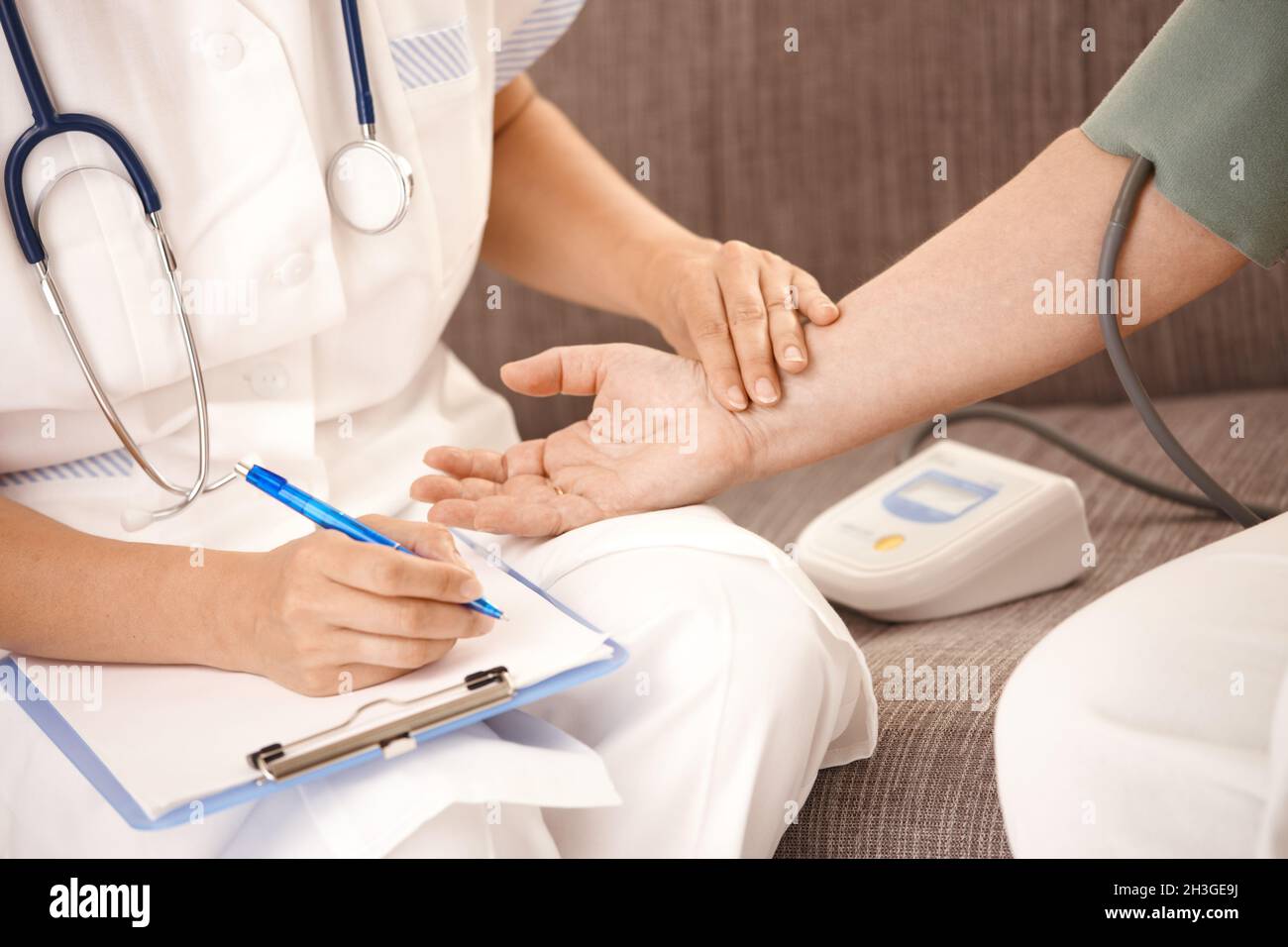 Closeup of hand checking heartbeat Stock Photo - Alamy