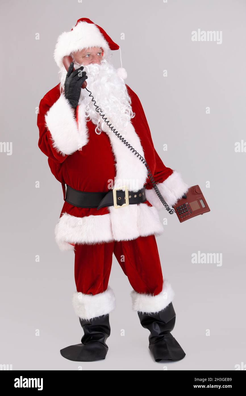 Full size photo of Santa talking on phone Stock Photo - Alamy