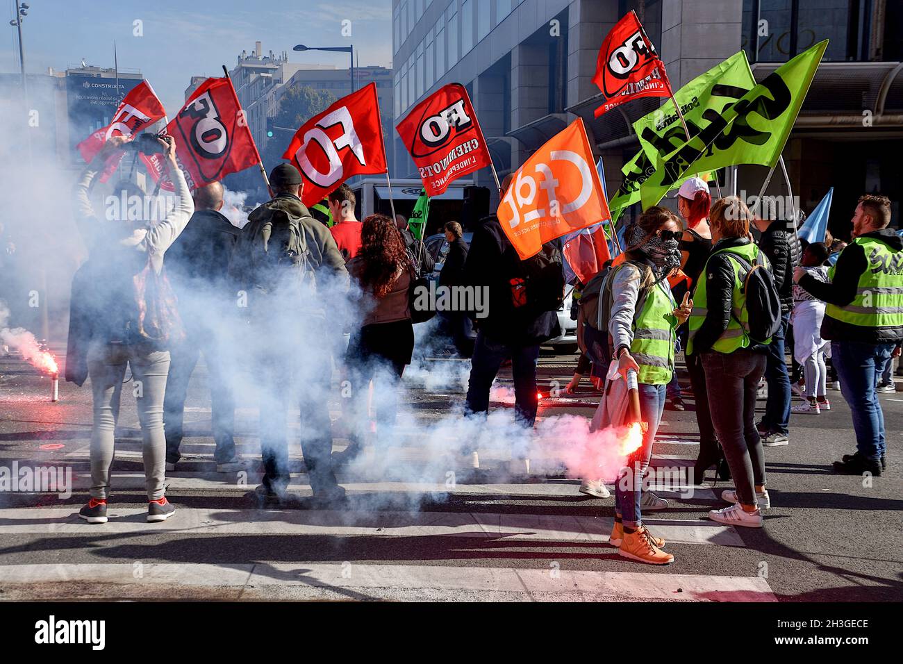 Protesters wave union flags and burn flares during the demonstration ...