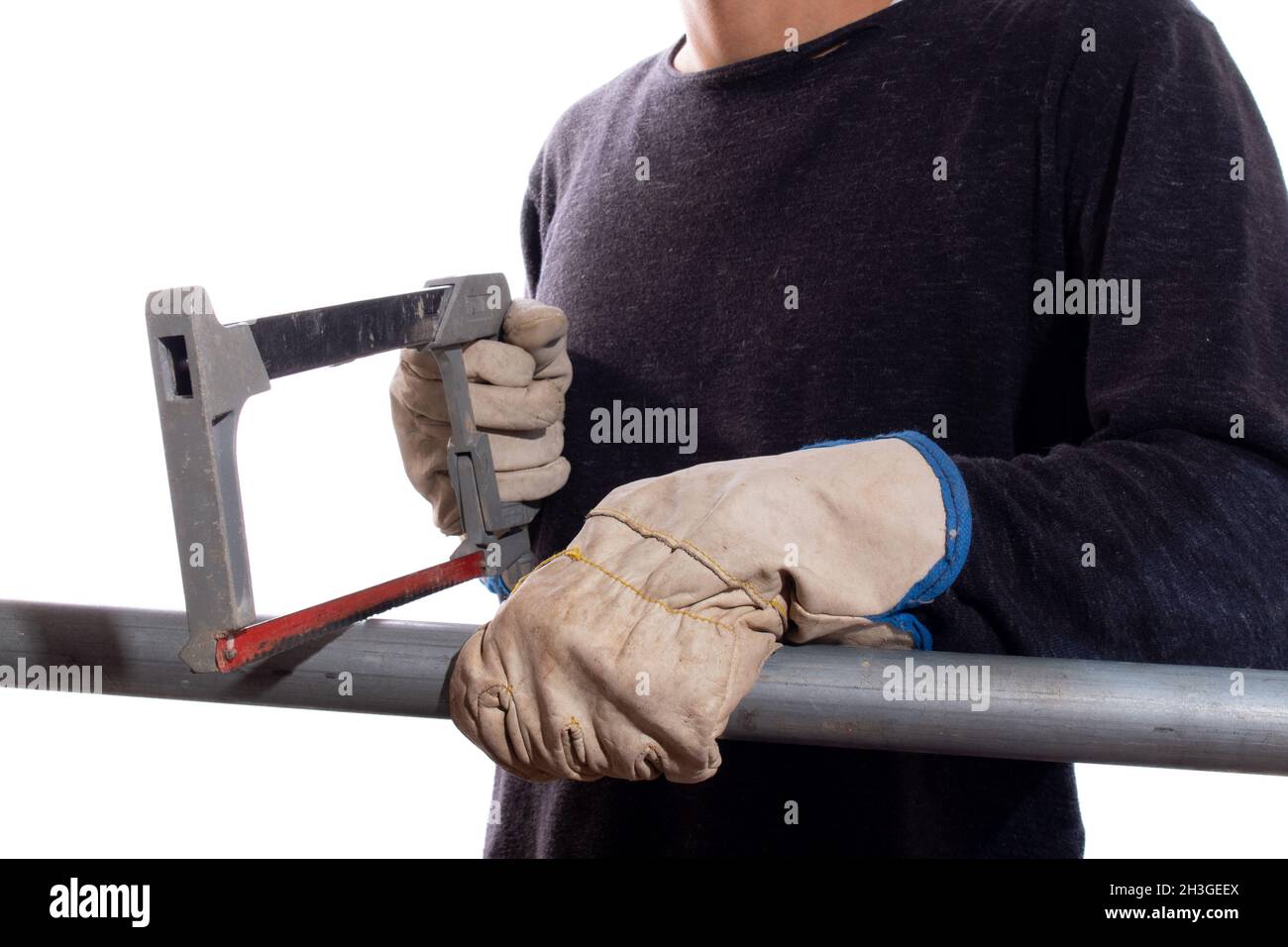 Man cutting iron pipe with hand saw, isolated on white background ...