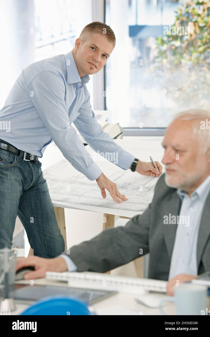 Young architect working on drawing pad Stock Photo - Alamy