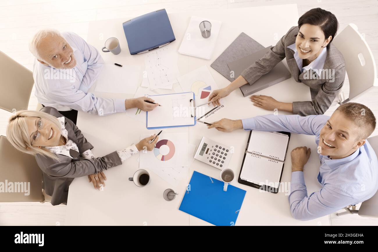 Happy businessteam working together Stock Photo - Alamy