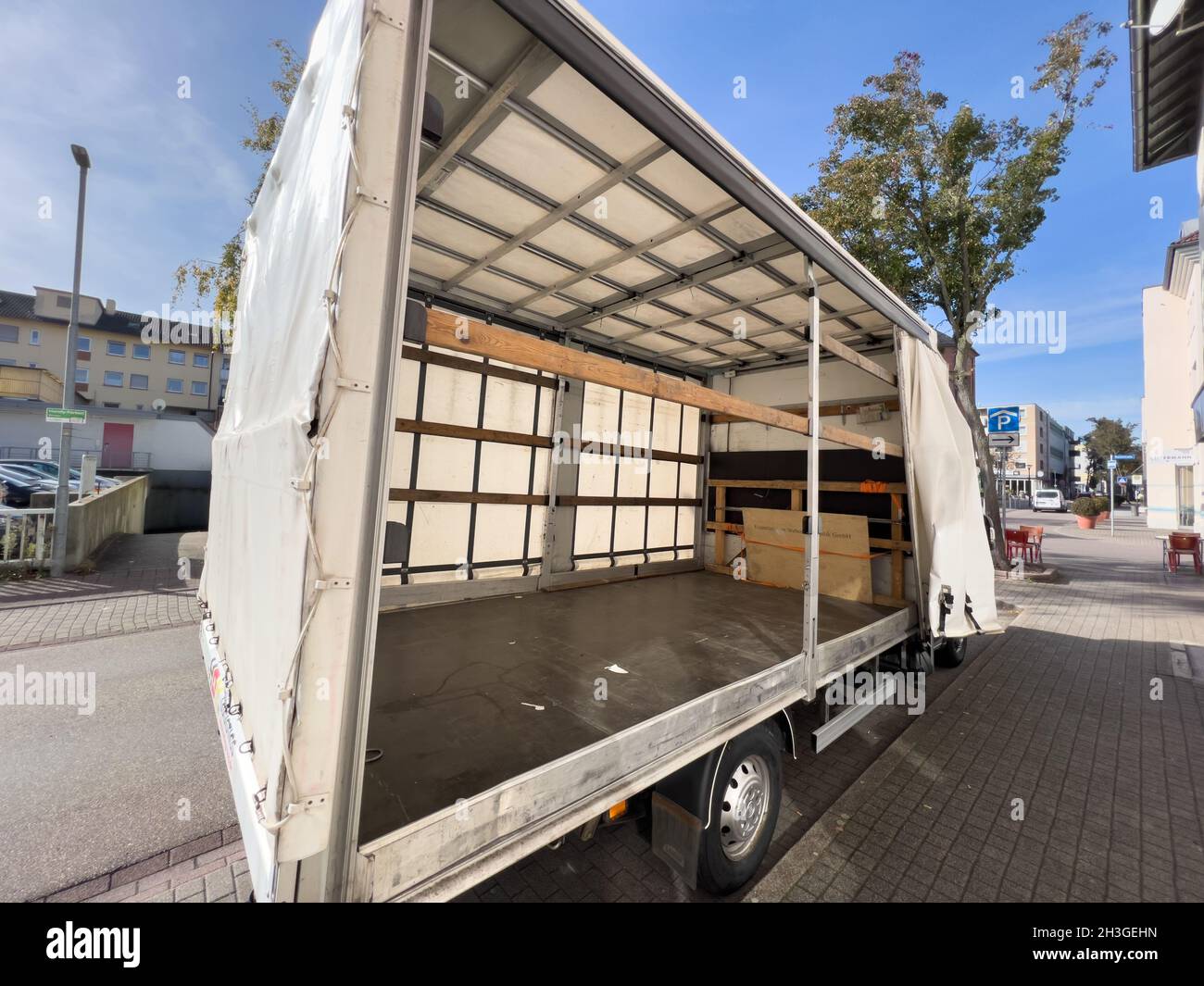 Open cargo van on the street of German city empty after the moving ...