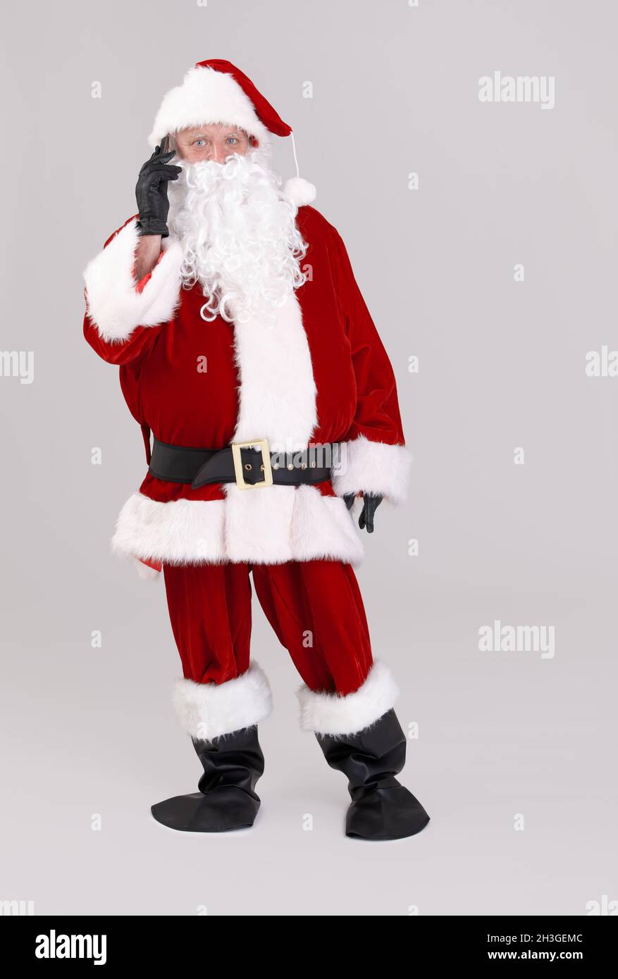 Santa talking on mobile phone Stock Photo - Alamy