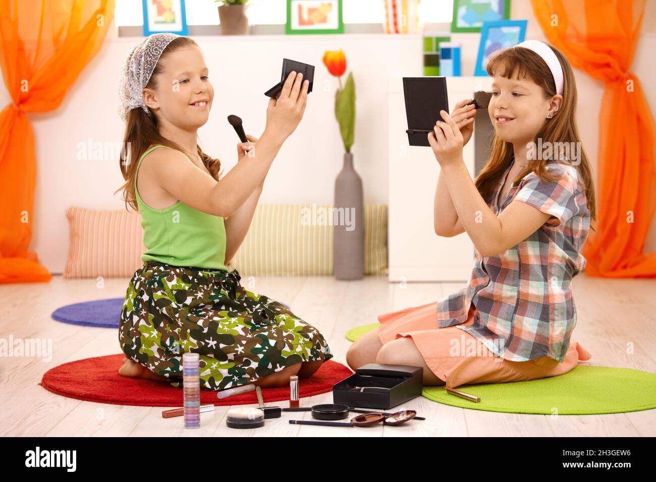 Two young girls playing with makeup Stock Photo - Alamy