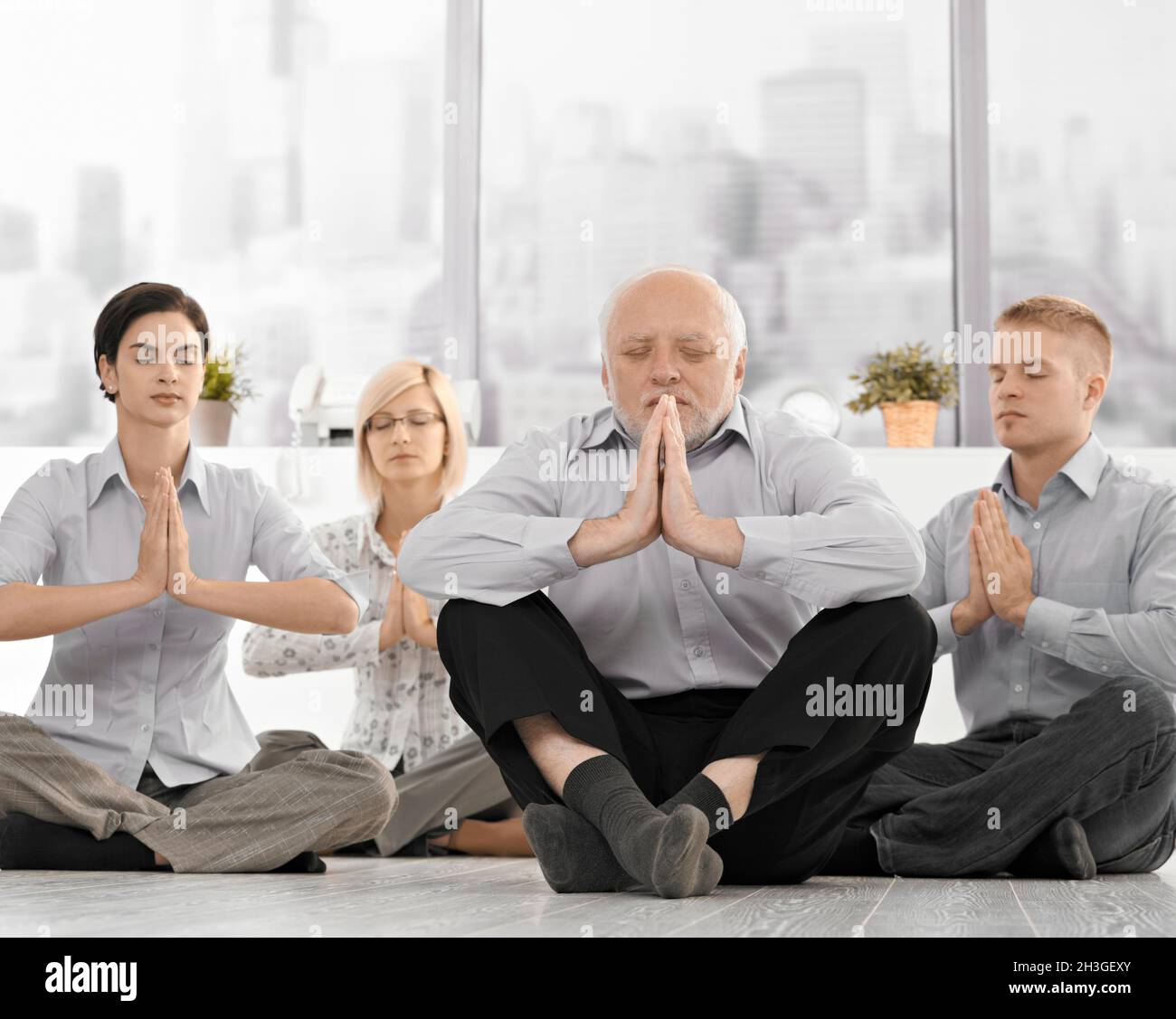 Group meditation in office hi-res stock photography and images - Alamy