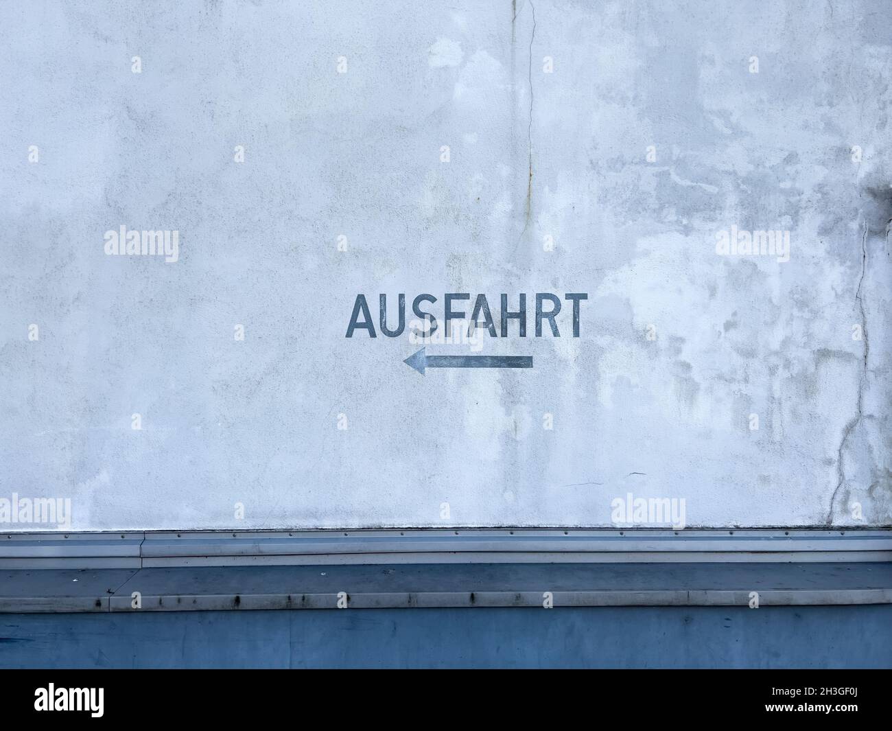 Ausfahrt translation from German language as exit signage on the wall ...