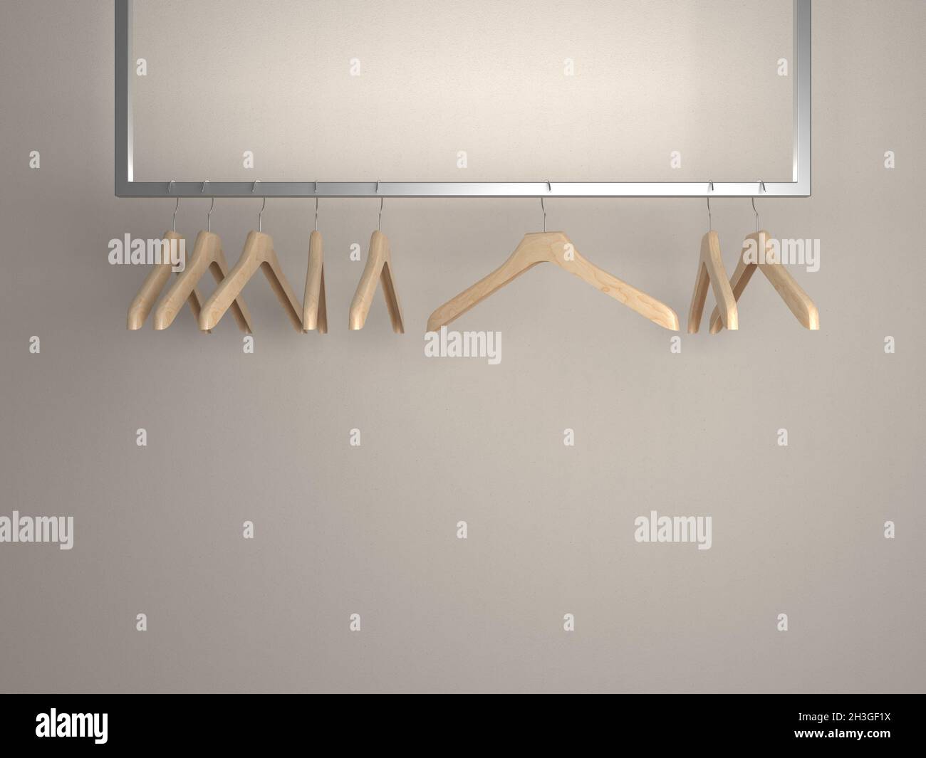 3D rendering of empty hangers for clothes on white background wall ...