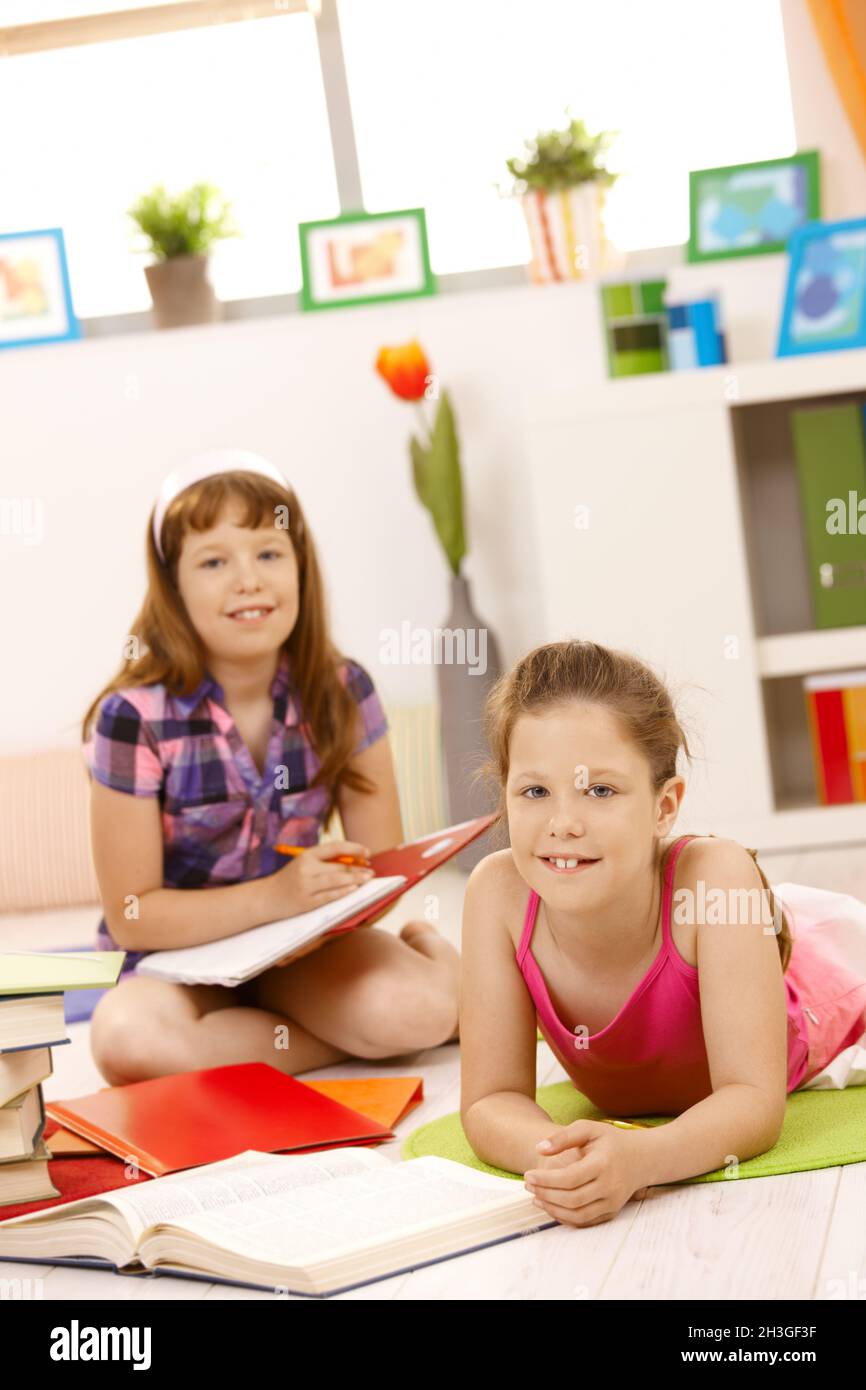 Portrait of girls doing homework Stock Photo - Alamy
