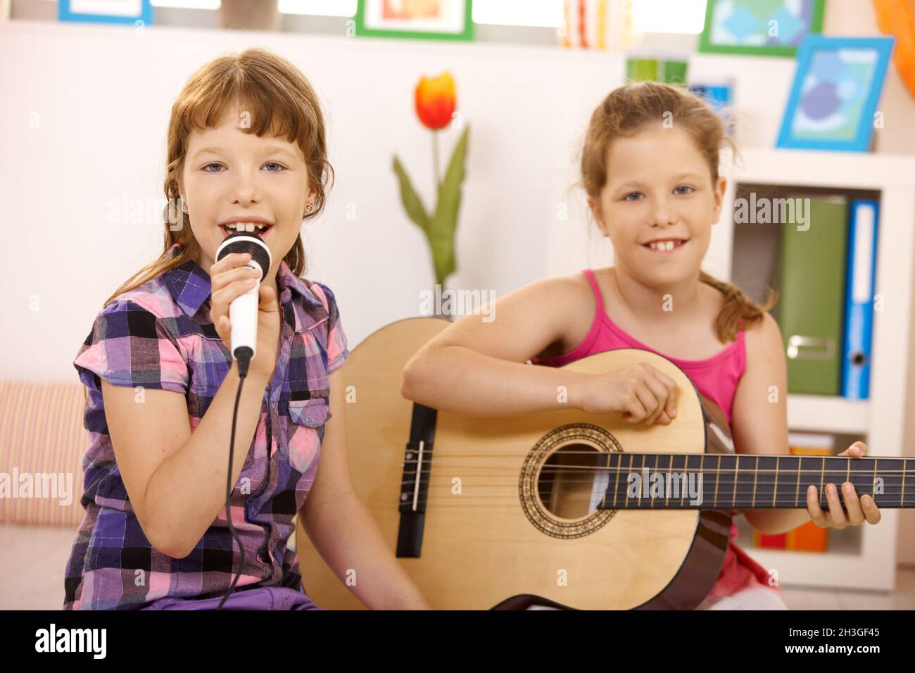 Girls performing music Stock Photo - Alamy