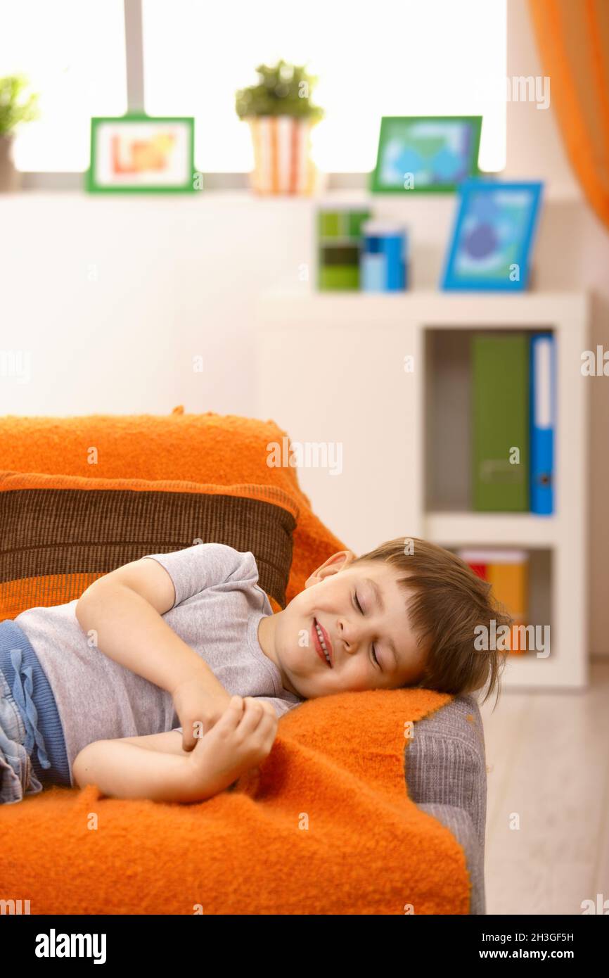 Smiling little boy having nap Stock Photo - Alamy