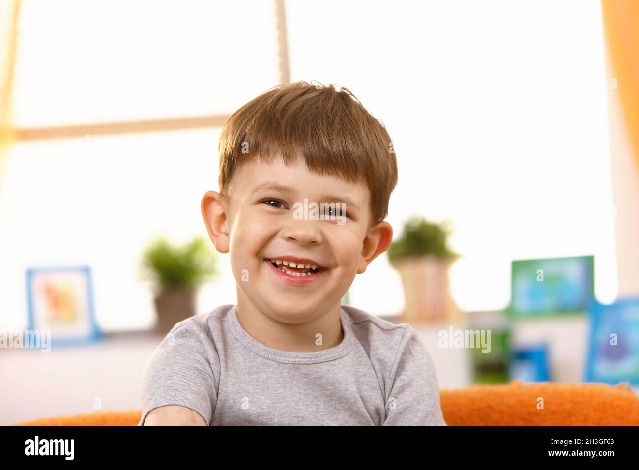 Happy little kid laughing Stock Photo - Alamy